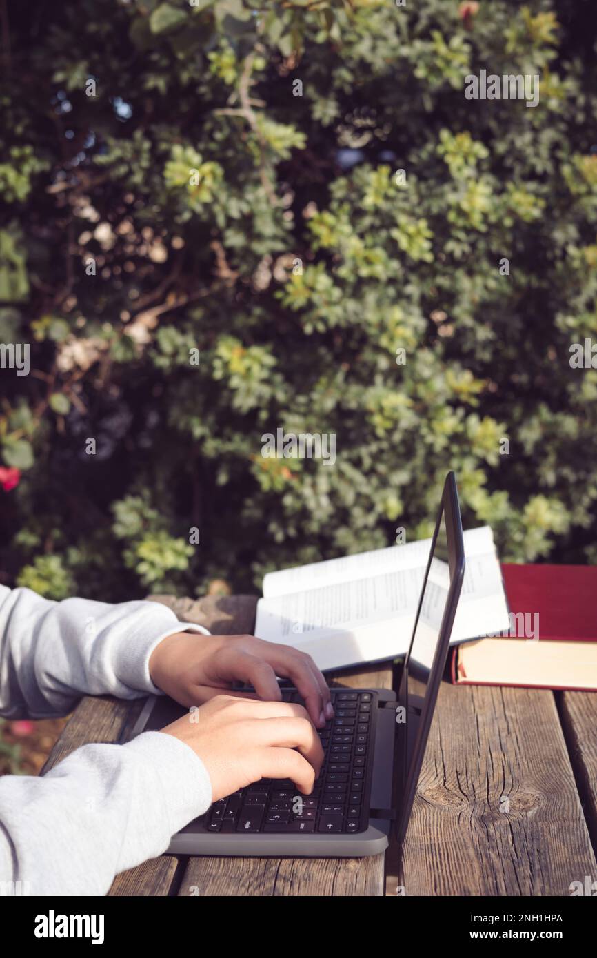detail of hands writing on laptop with copy space Stock Photo - Alamy