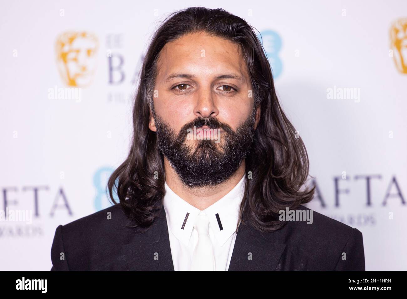 Shazad Latif poses for photographers at the 76th British Academy Film ...