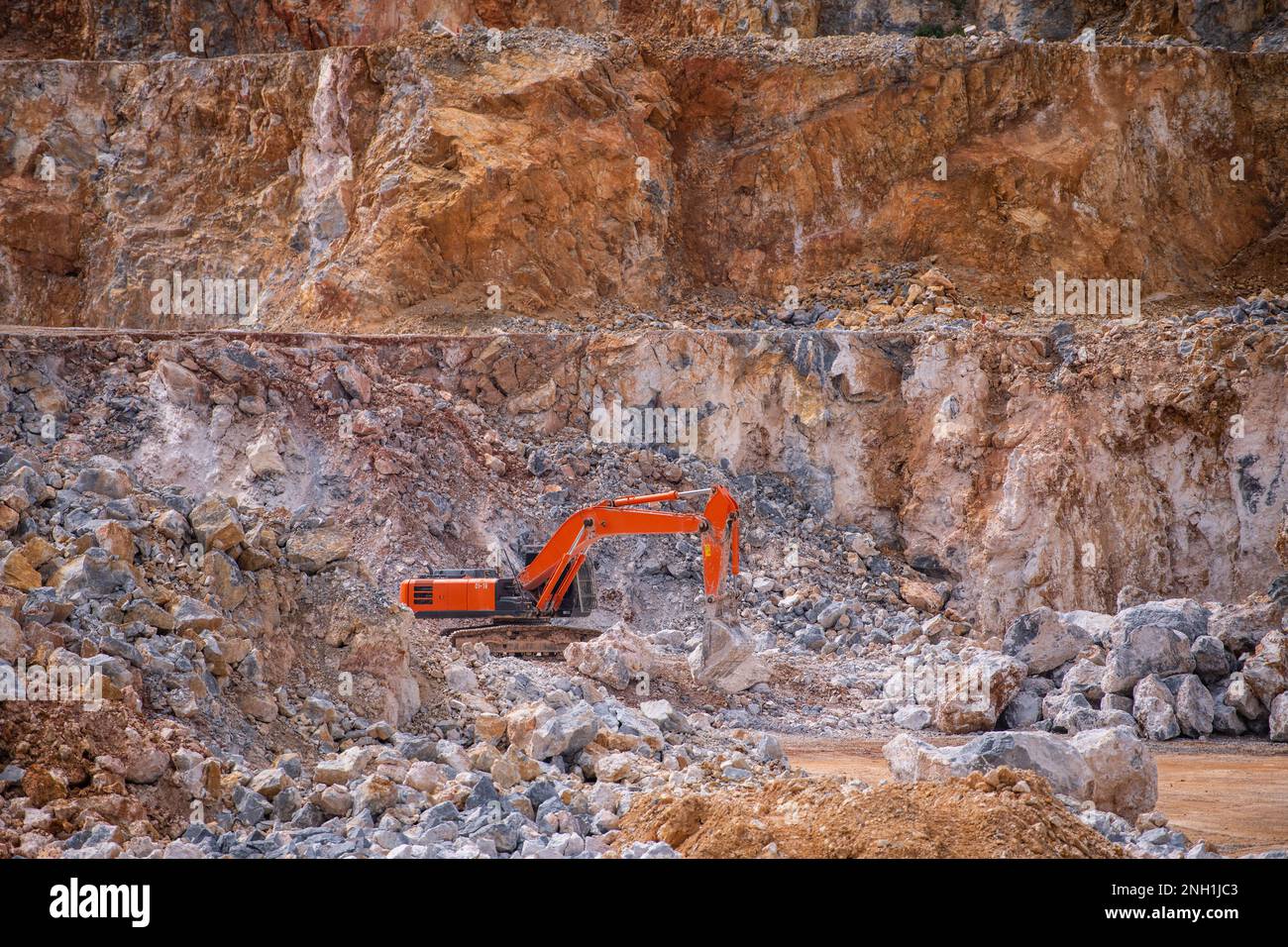 excavator working at gravel mine in Thailand Stock Photo - Alamy