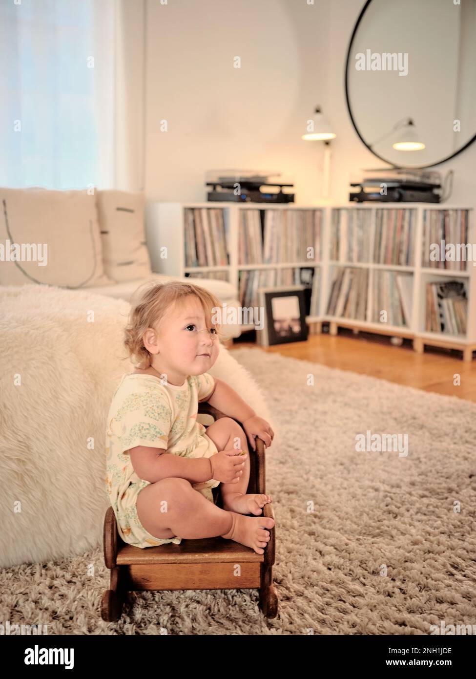 Girl sitting in rocking chair hi-res stock photography and images - Alamy