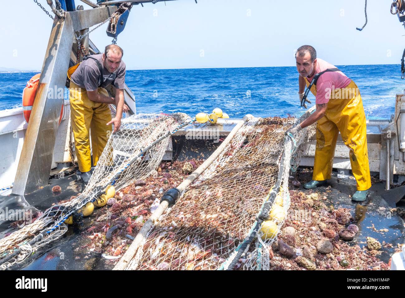 Laying out the fishing net Stock Photo - Alamy