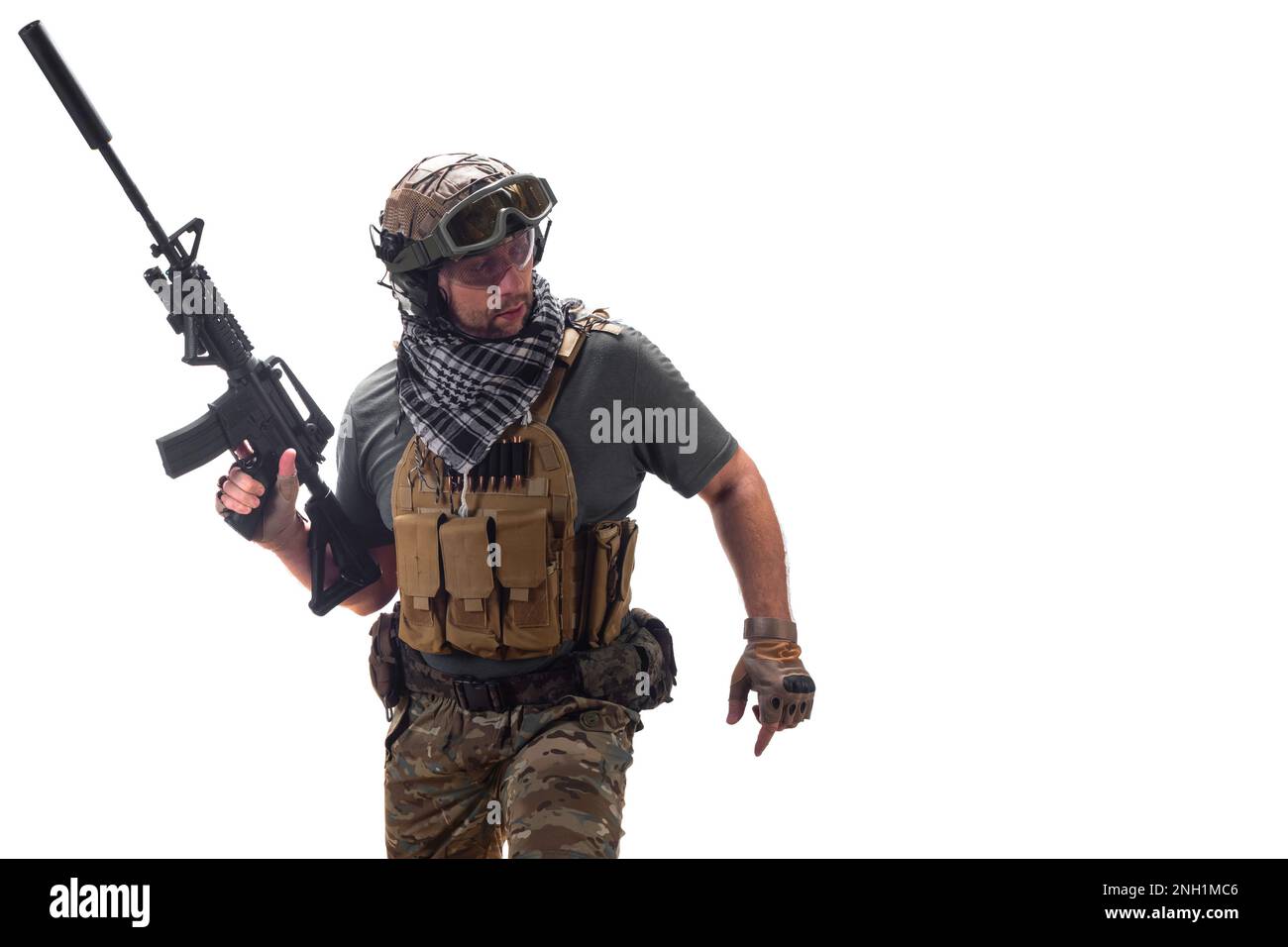 Walking ercenary soldier with an automatic rifle in his hand ...
