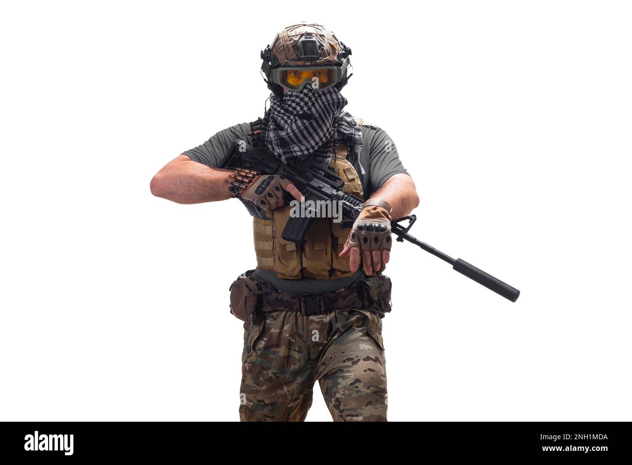 A special mercenary soldier with an automatic rifle stands and looks ...