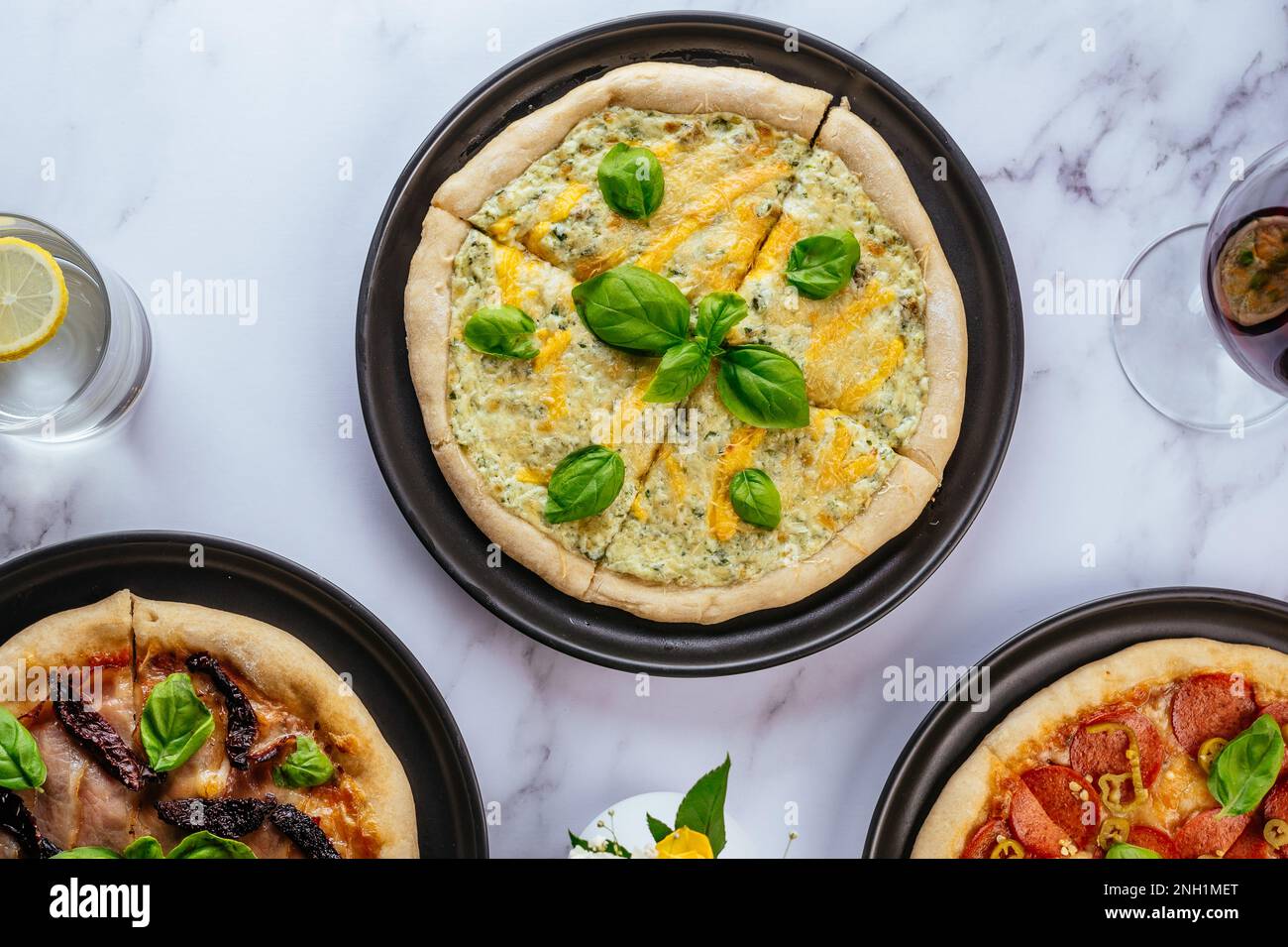 pizza four cheeses on a marble table Stock Photo - Alamy