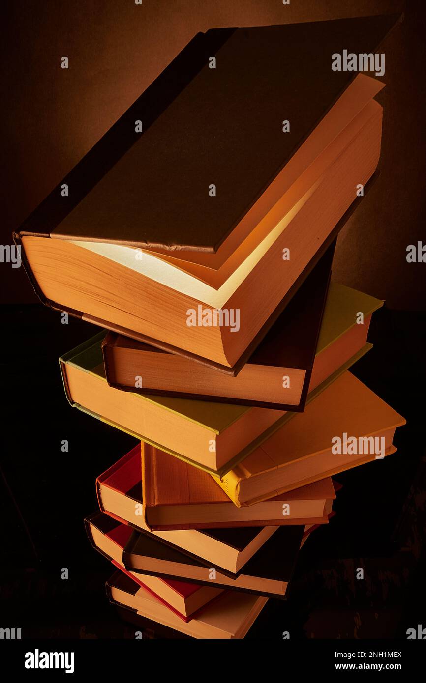 An unusually tall stack of books Stock Photo - Alamy
