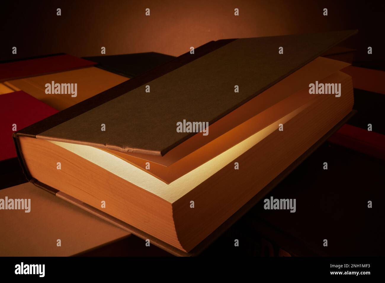 A book radiating with knowledge Stock Photo - Alamy