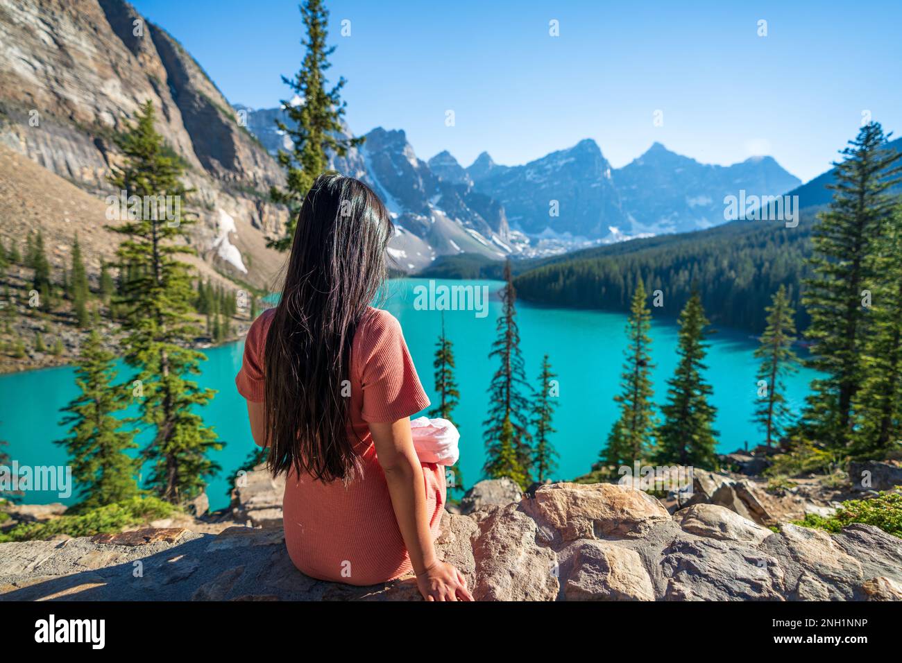 Young girl enjoying Moraine Lake beautiful scenery. Banff National Park ...