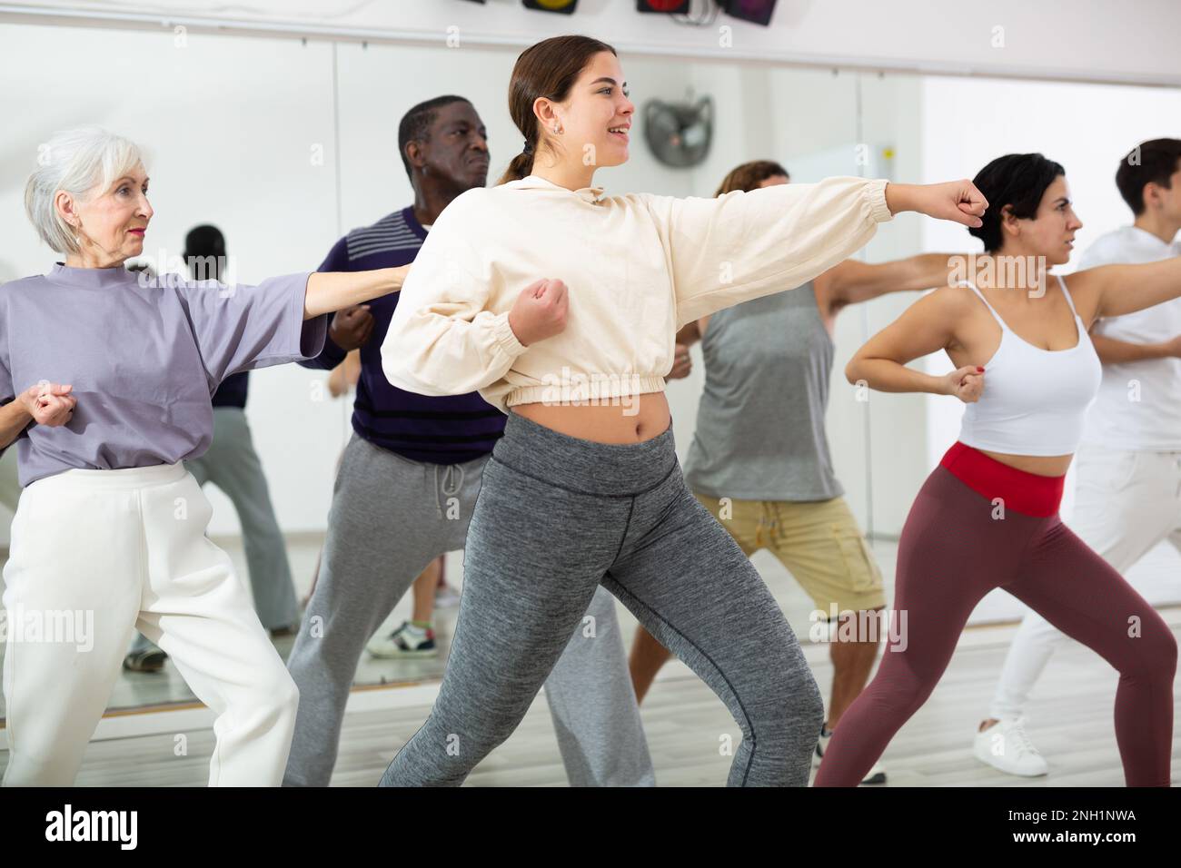 Girl practicing punches during group self defense course Stock Photo ...