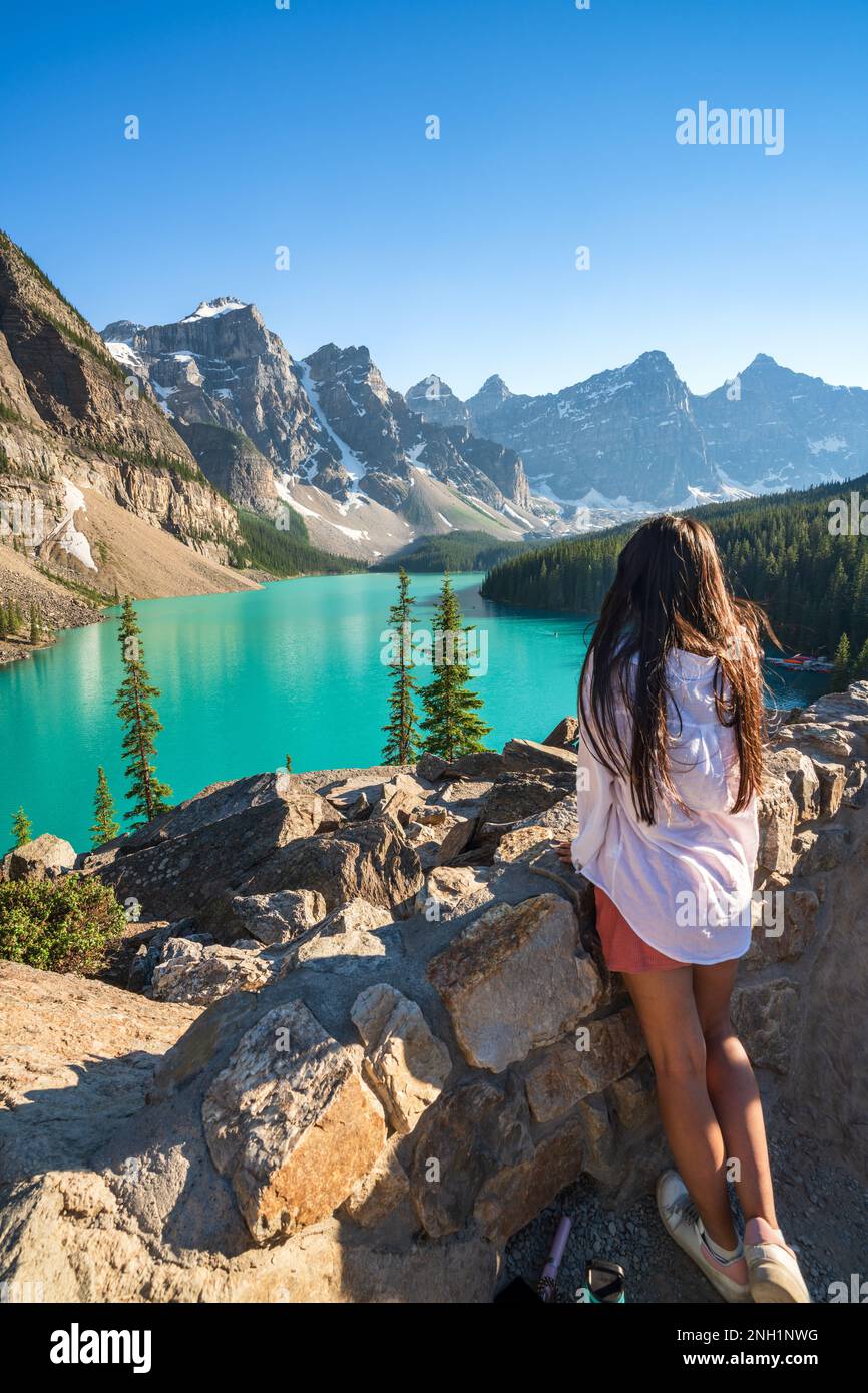 Young girl enjoying Moraine Lake beautiful scenery. Banff National Park ...