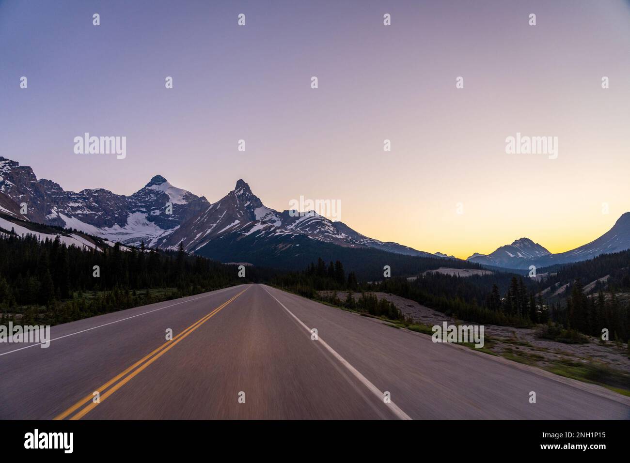Driving on Icefields Parkway at twilight time. Alberta Highway 93 ...