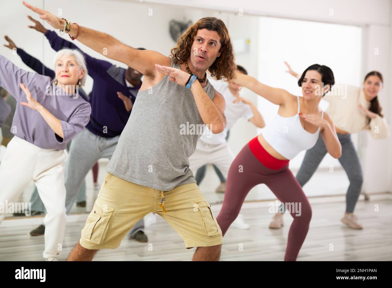 Group of adult people practices dance aerobics Stock Photo - Alamy
