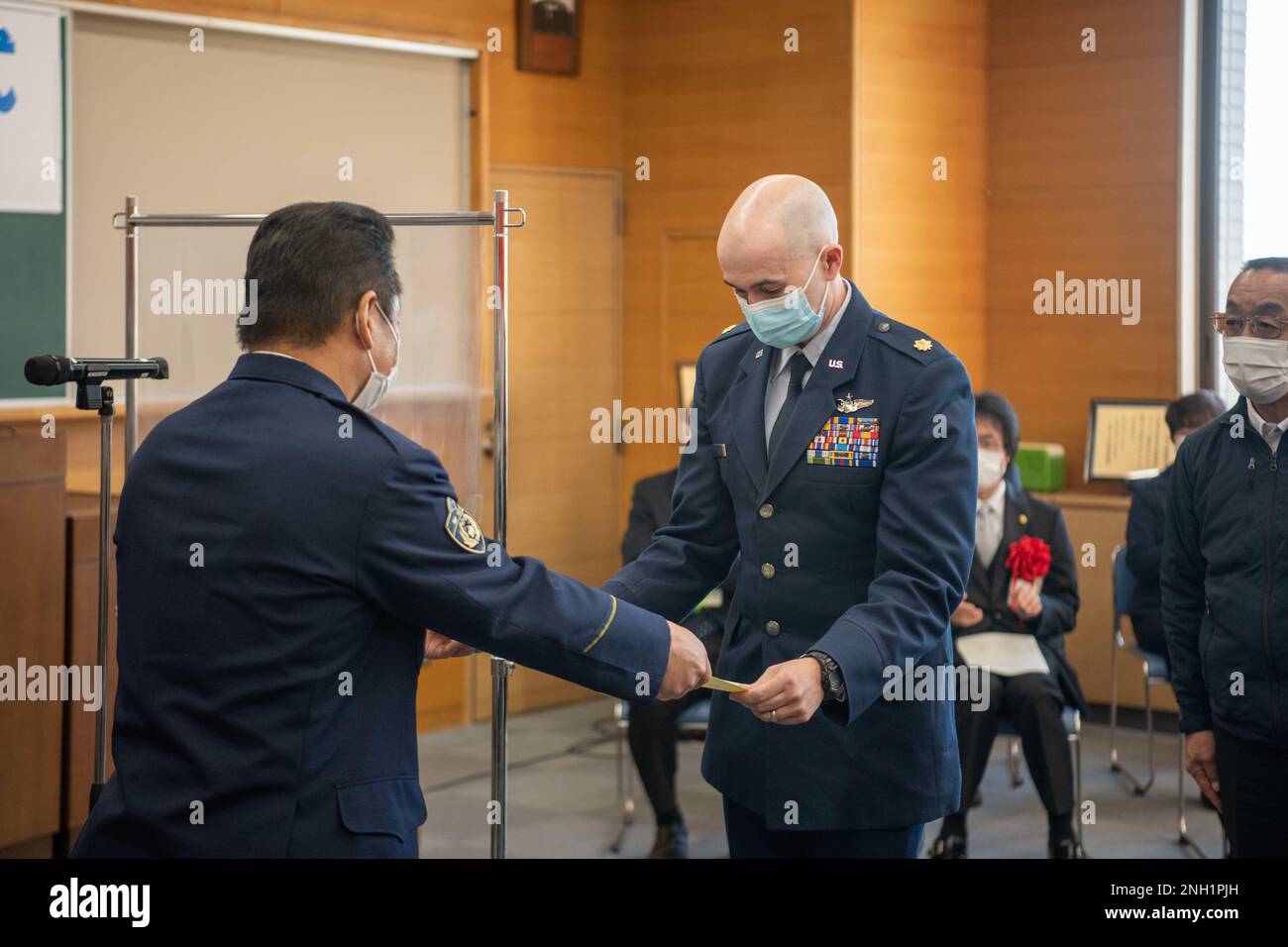 U.S. Air Force Maj. Nicholas Reeves (left) receives the Metropolitan ...