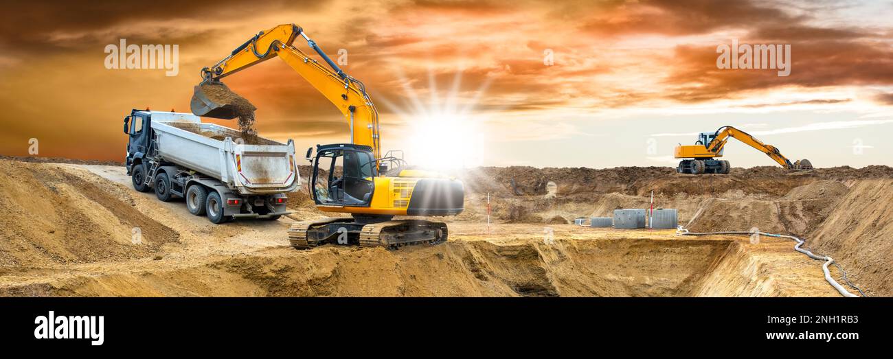 excavator is working and digging at construction site Stock Photo - Alamy