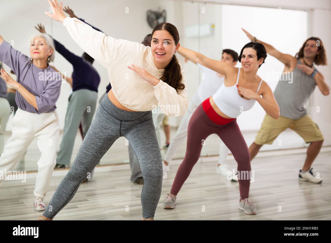 Group of adult people practices dance aerobics Stock Photo - Alamy