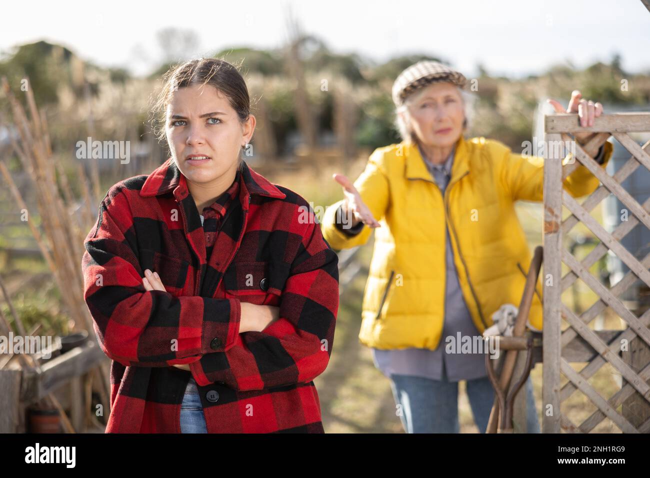 Conflict between female neighbors in country farm Stock Photo - Alamy