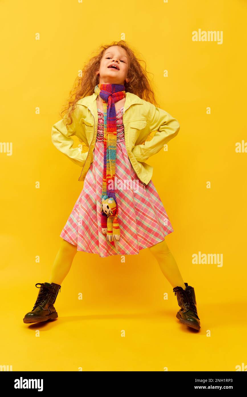 Extraordinary look. Little cute girl, child with curly hair posing in ...