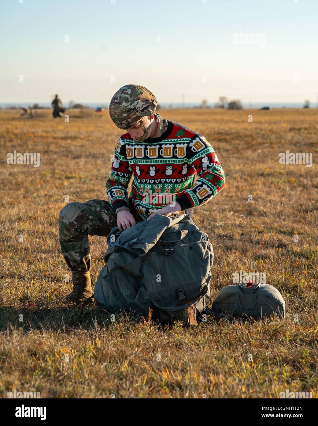 A U.S. Army paratrooper assigned to the 173rd Airborne Brigade recovers ...
