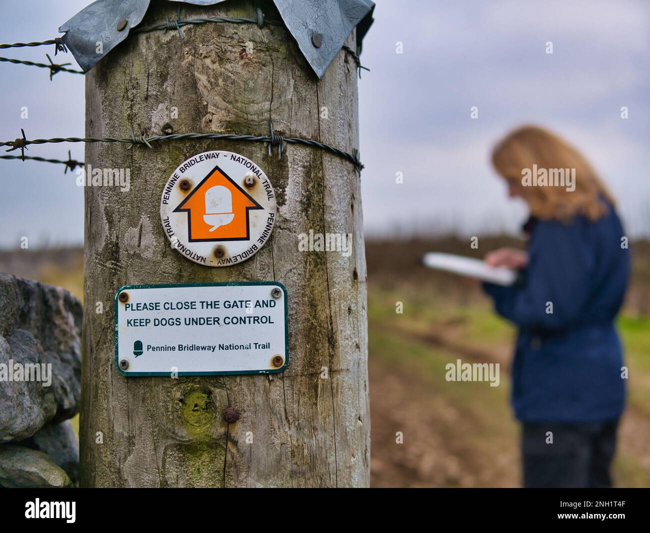 Signage marks the way of the Pennine Bridleway National Trail on a ...