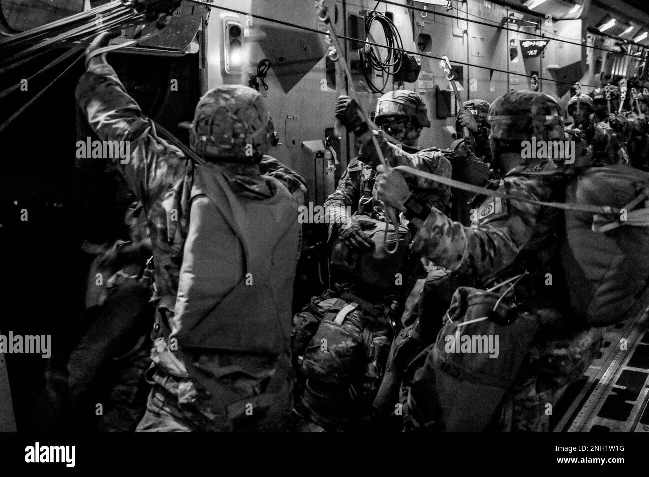 Paratroopers from 2nd Brigade Combat Team, 82nd Airborne Division, exit ...