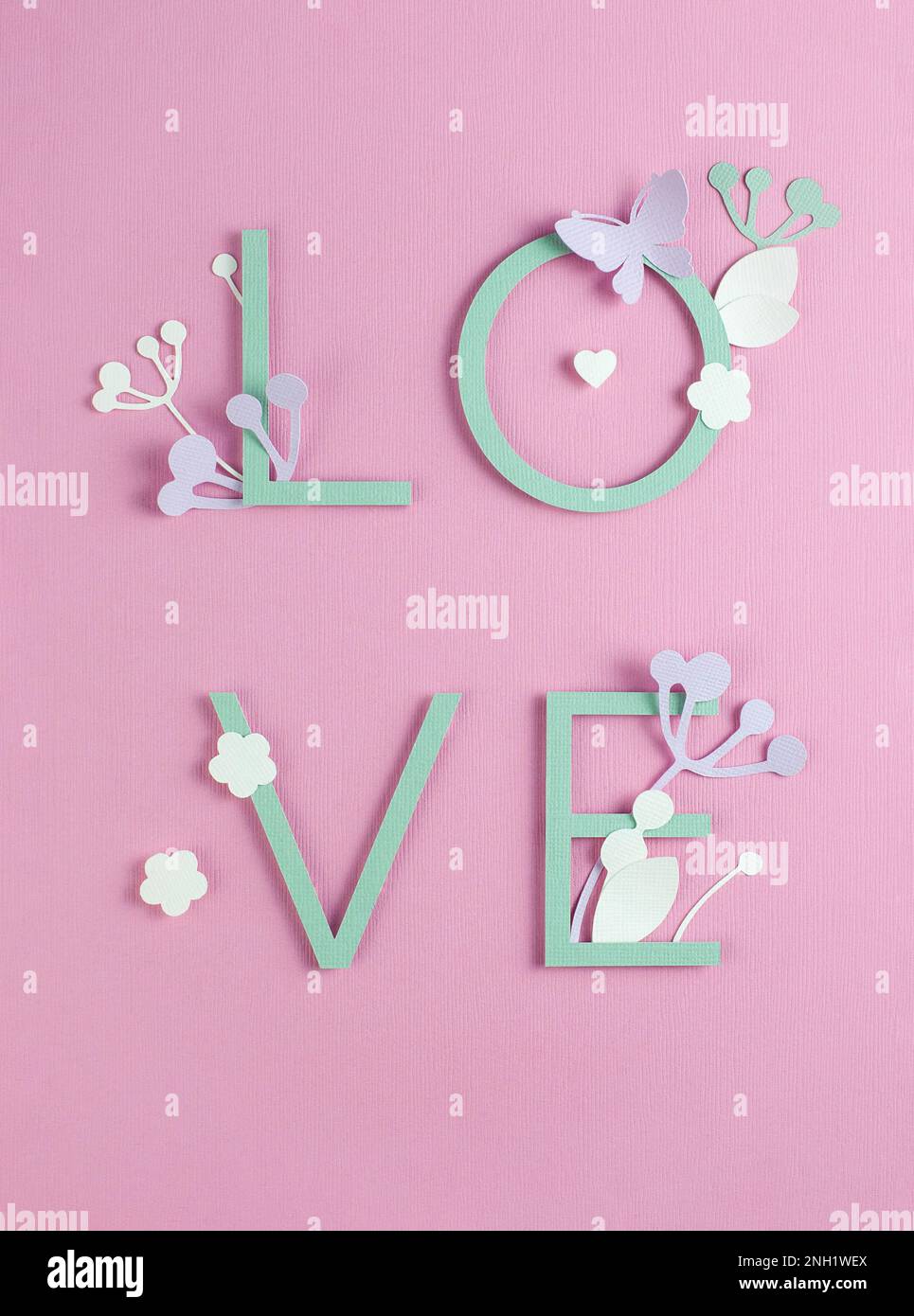 Romantic composition in pastel colors with lettering Love, paper ...