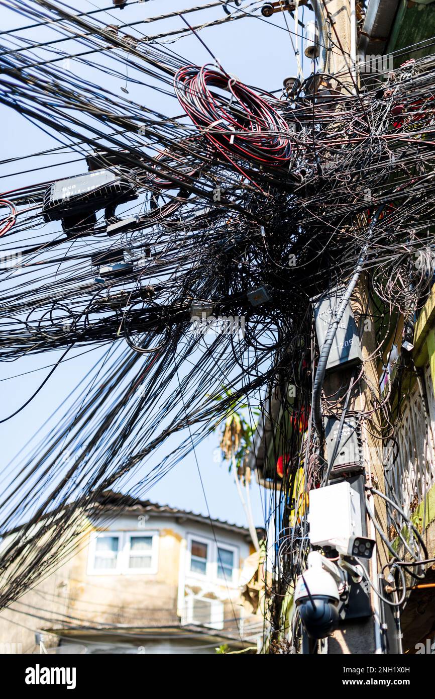 Intertwined electric wires in front of buildings which is the first ...