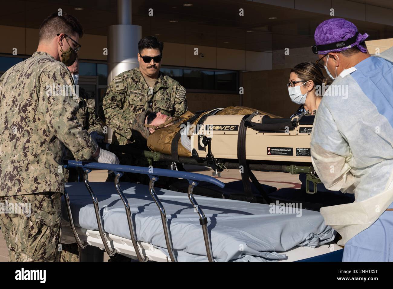 U.S. Navy medical personnel with Naval Hospital Camp Pendleton move a ...