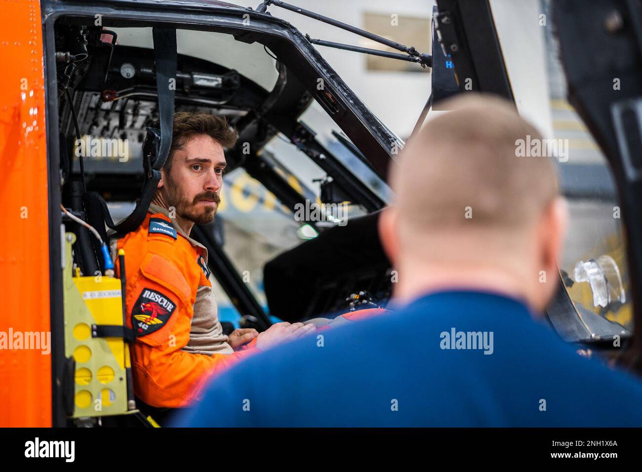 A Royal Canadian Air Force CH-149 Cormorant helicopter crew member from ...