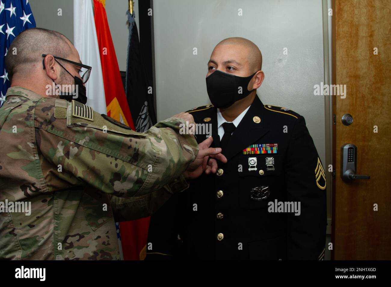 Staff Sgt. Oscar Lopez, 160th Theater Signal Brigade, receives help ...