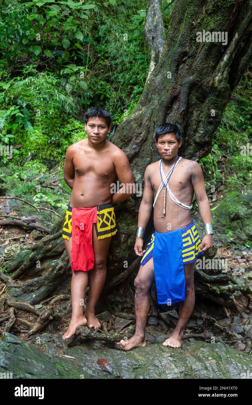 Two indigenous Embera men in traditional dress in the rainforest in ...