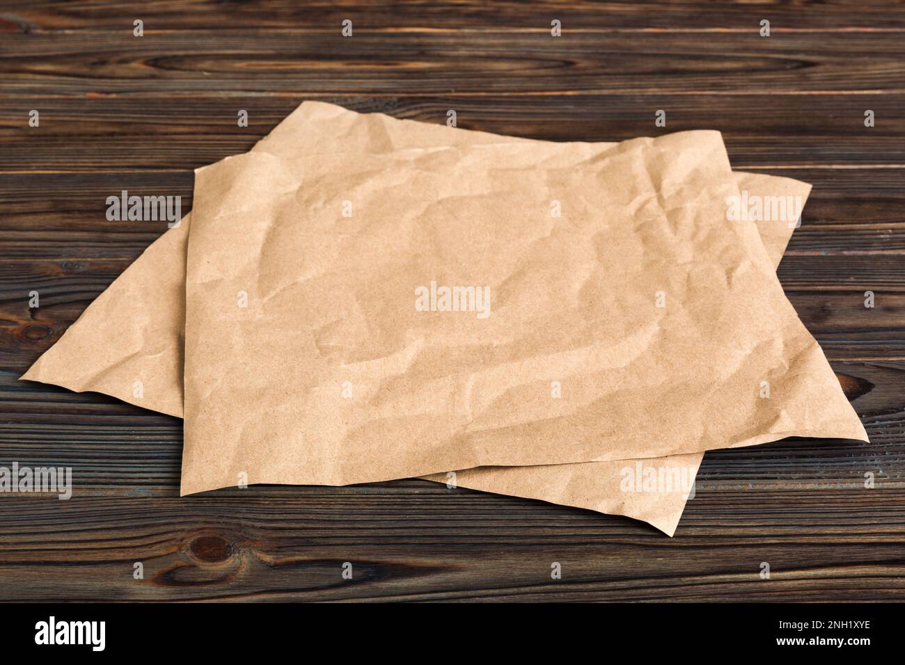 top view with baking parchment empty on table background. Folded cloth ...