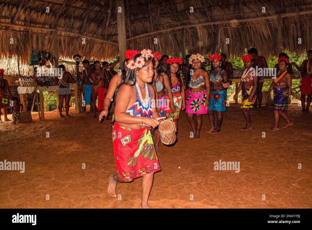Indigenous Embera women in traditional dress perform a dance an Embera village in Panama Stock ...