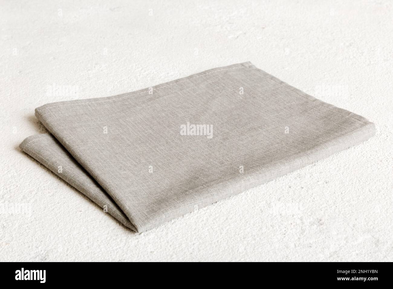 top view with gray kitchen napkin isolated on table background. Folded ...