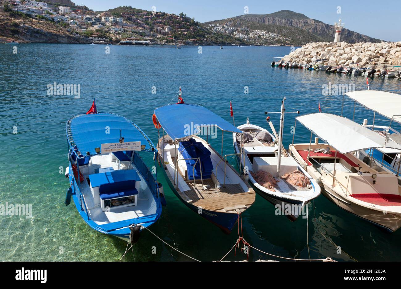 Small fishing boats moored in the harbour at Kalkan, Turkey. July 2022 ...