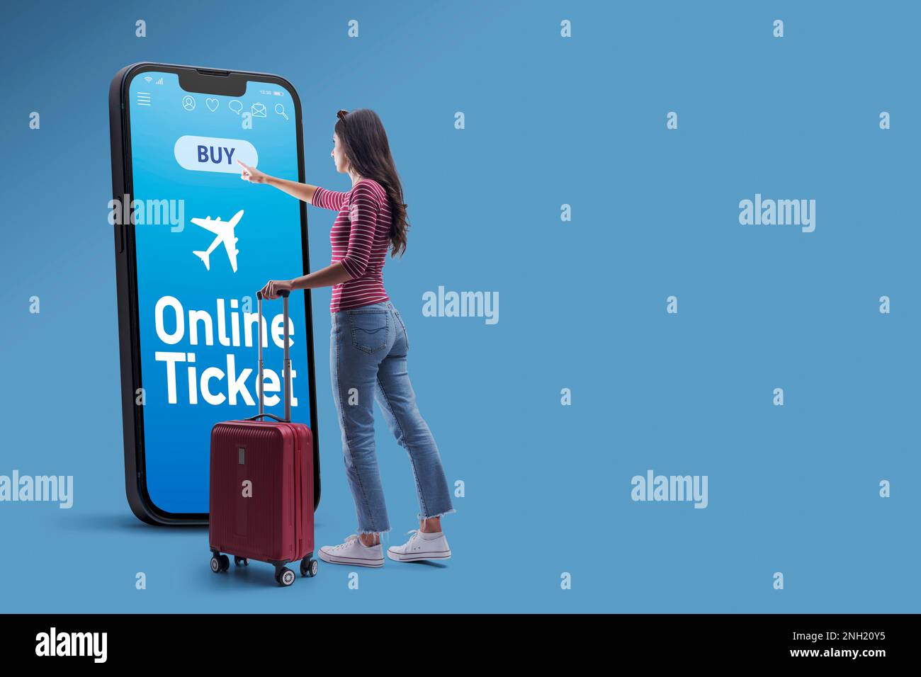 Young woman booking her air ticket online using a big smartphone ...