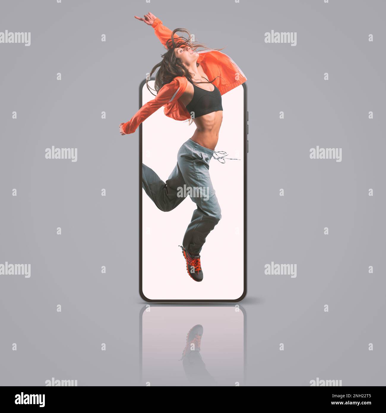 Professional dancer jumping out of a smartphone screen, mobile apps and ...