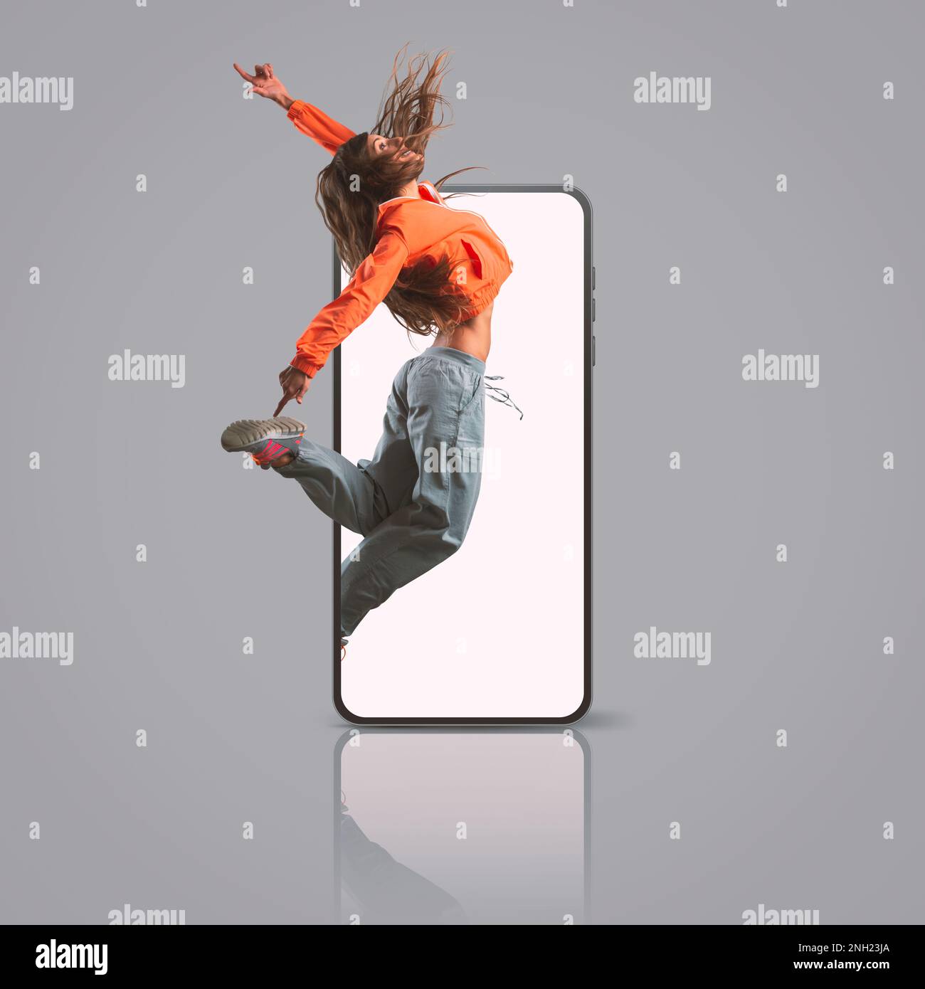 Professional dancer jumping out of a smartphone screen, mobile apps and ...