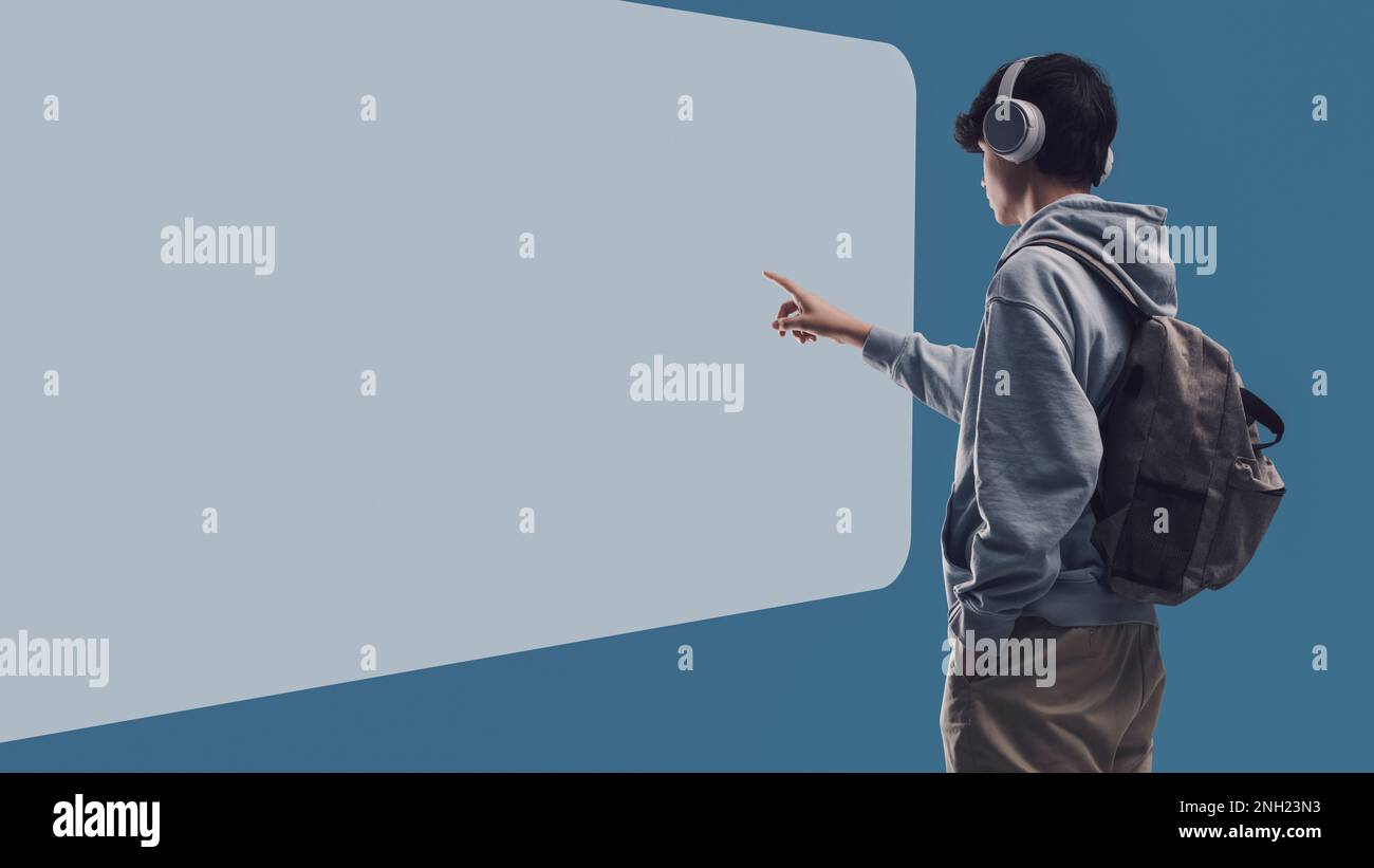 Adolescent student interacting with a touch screen whiteboard, online ...