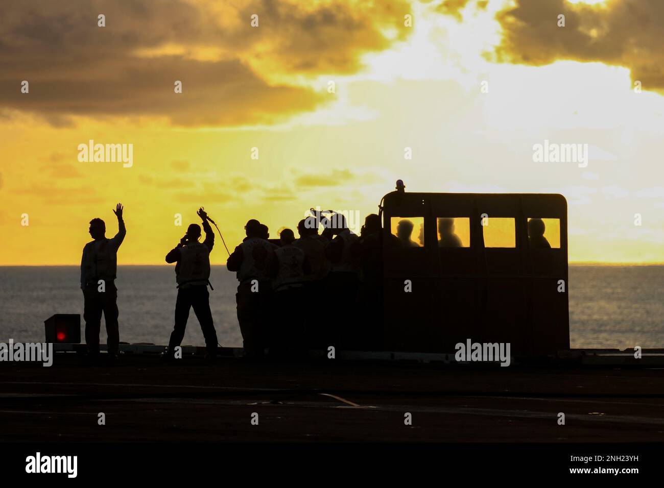 Landing Signal Officers observe flight operations on the flight deck of ...