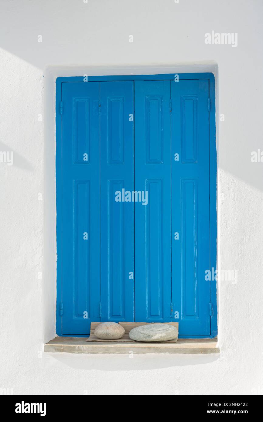 Blue window in traditional style of the Cyclades islands in the Chora ...
