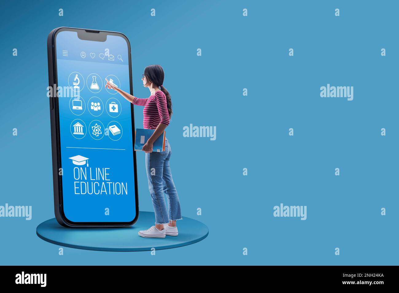 Female student using a big smartphone with online learning user ...