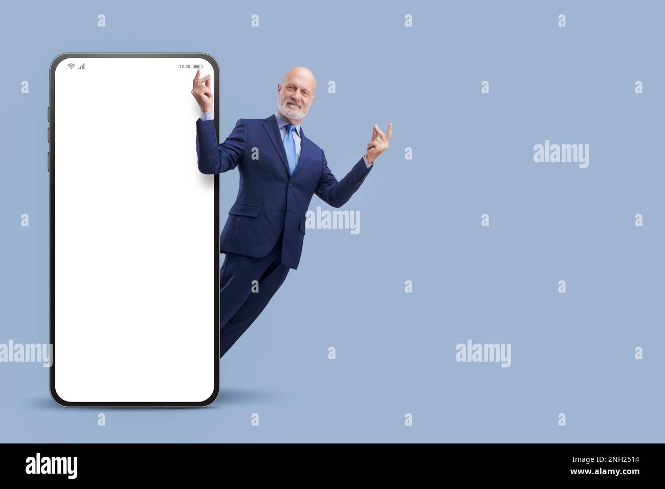 Successful happy businessman and big smartphone with blank screen, he ...