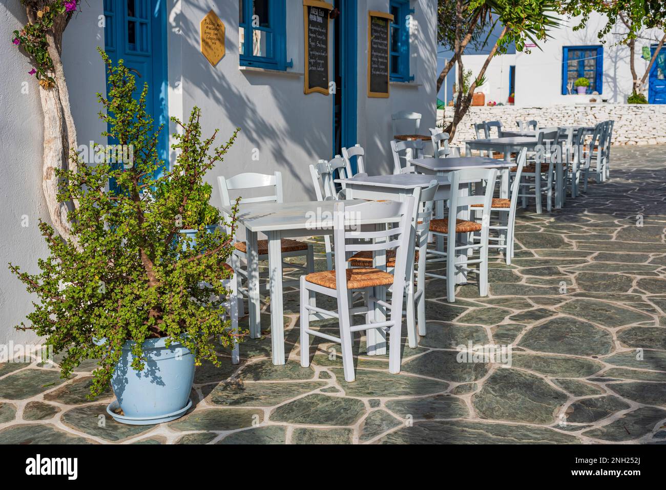 Traditional Greek taverna in Chora village, Folegandros Stock Photo - Alamy