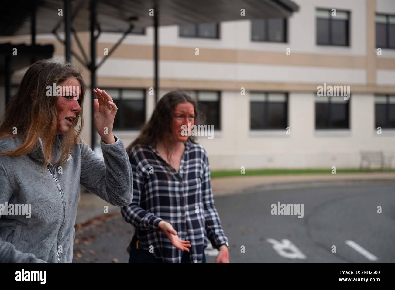 Team Dover Airmen portraying burn victims seek medical help during a ...