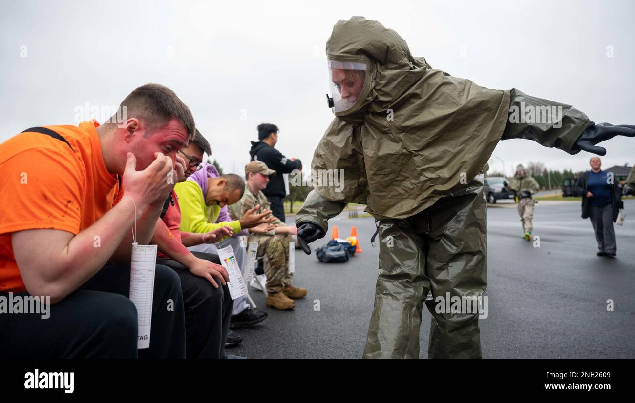 Team Dover Airmen portraying burn victims wait for medical help during ...