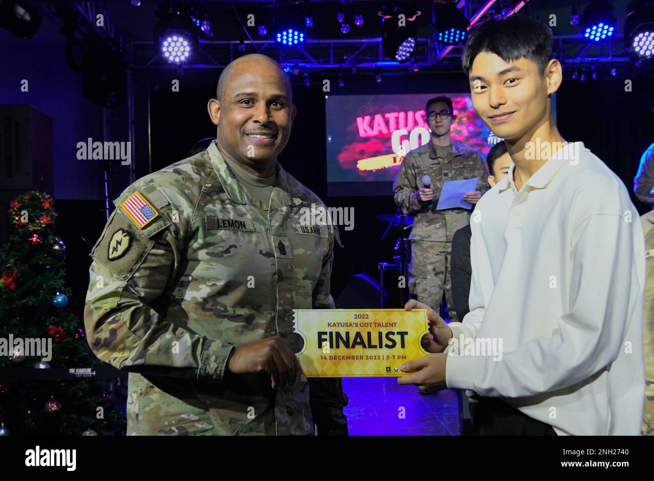 Cpl. Sung Gu Jung receives a finalist ticket from U.S. Army Command Sgt ...