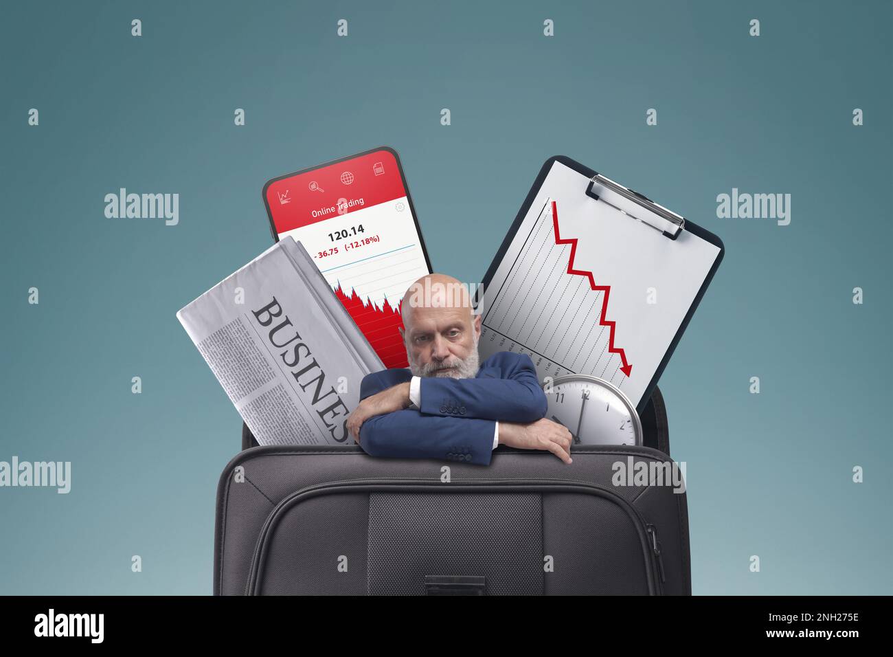 Stressed sad businessman and financial graphs showing loss in a ...