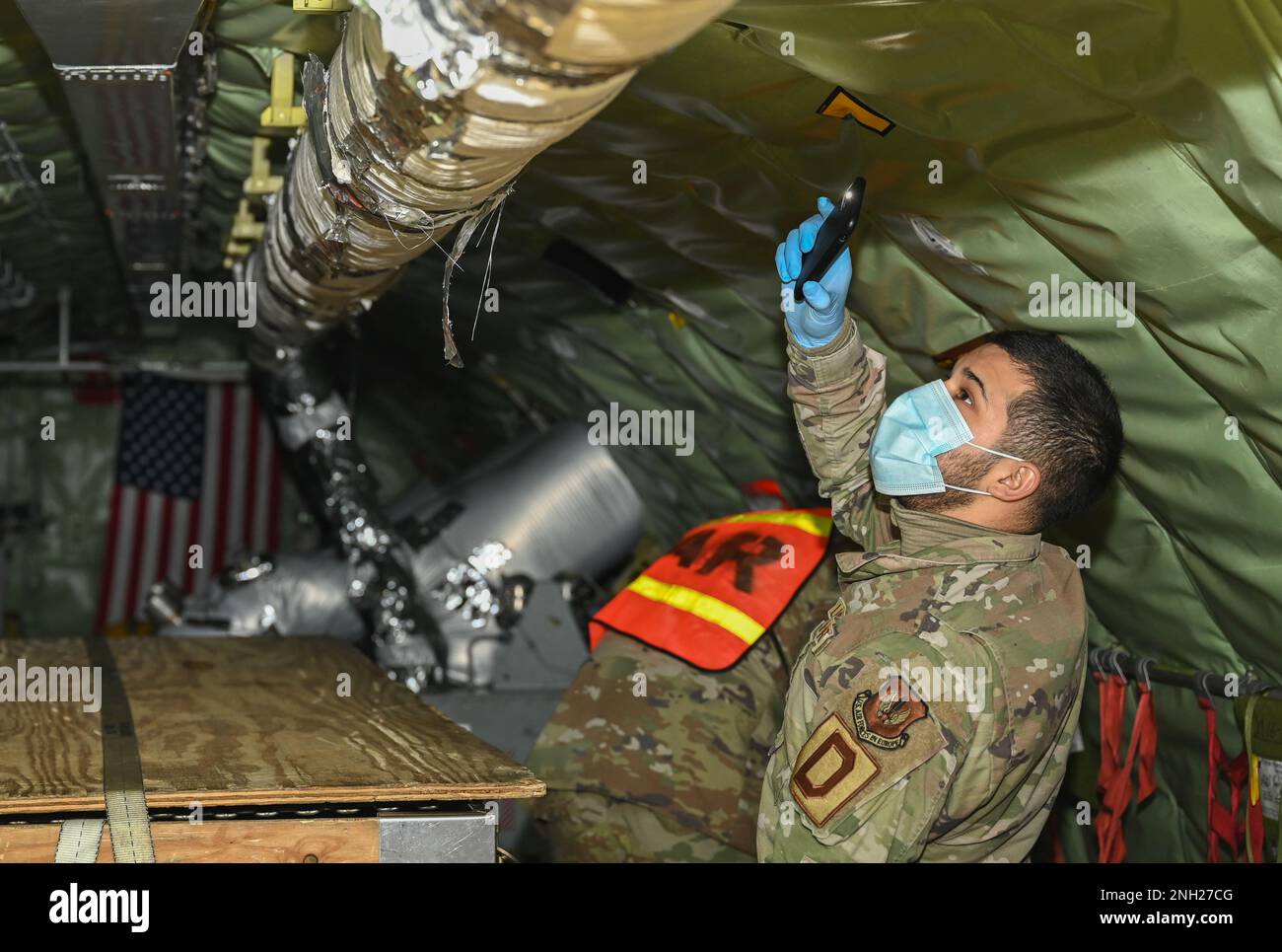 Royal Air Force Mildenhall Airmen thoroughly search the interior of a ...
