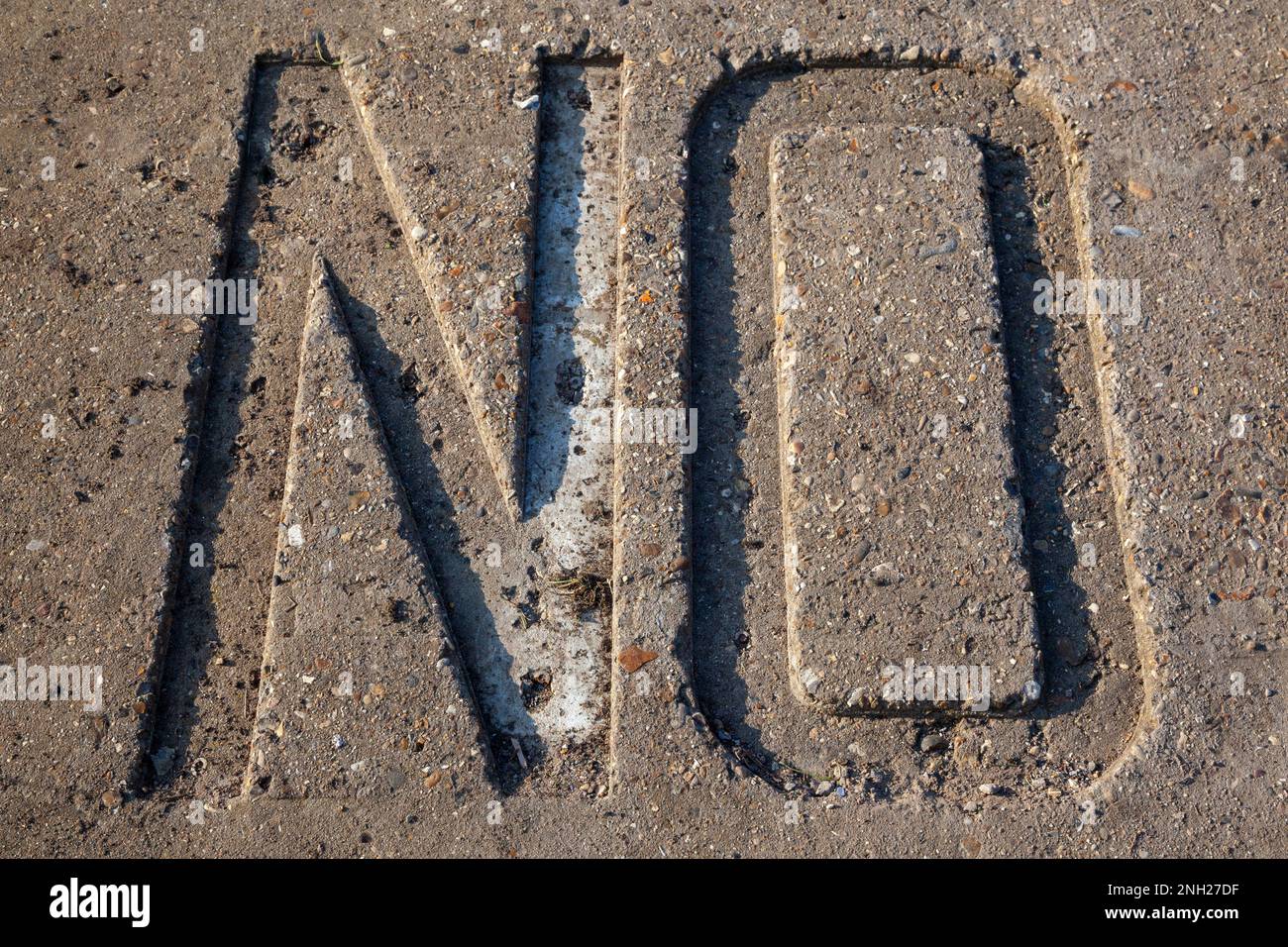 The text 'No' embossed in concrete Stock Photo - Alamy