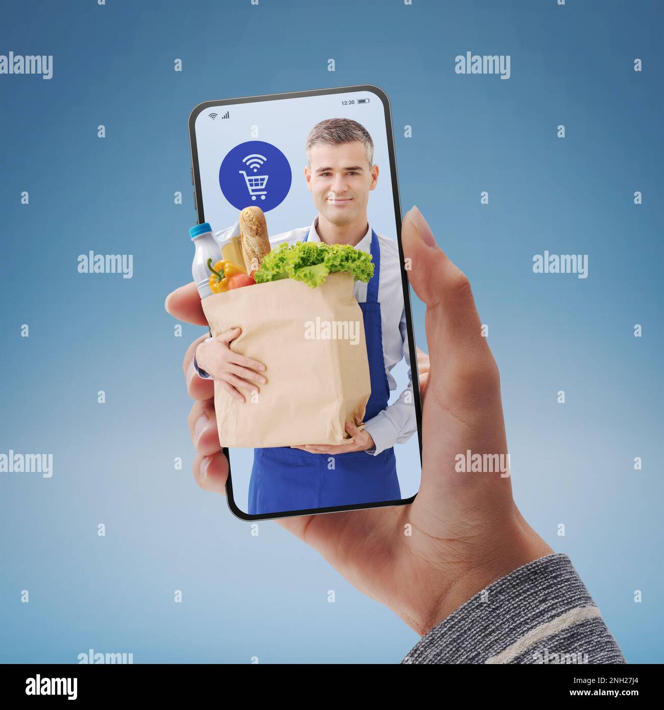 Online grocery shopping app: shop assistant holding a full grocery bag ...