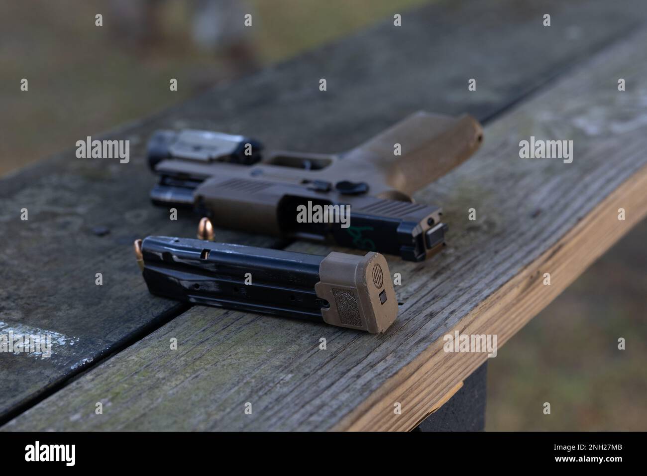 A cleared M18 pistol lays on the firing line during the pistol team ...